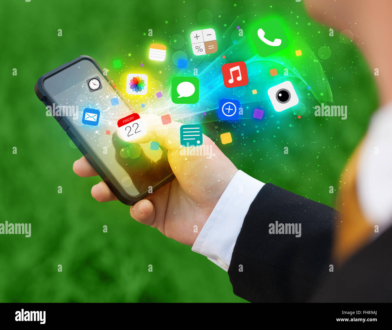 Hand holding smartphone with colorful app icons Stock Photo - Alamy