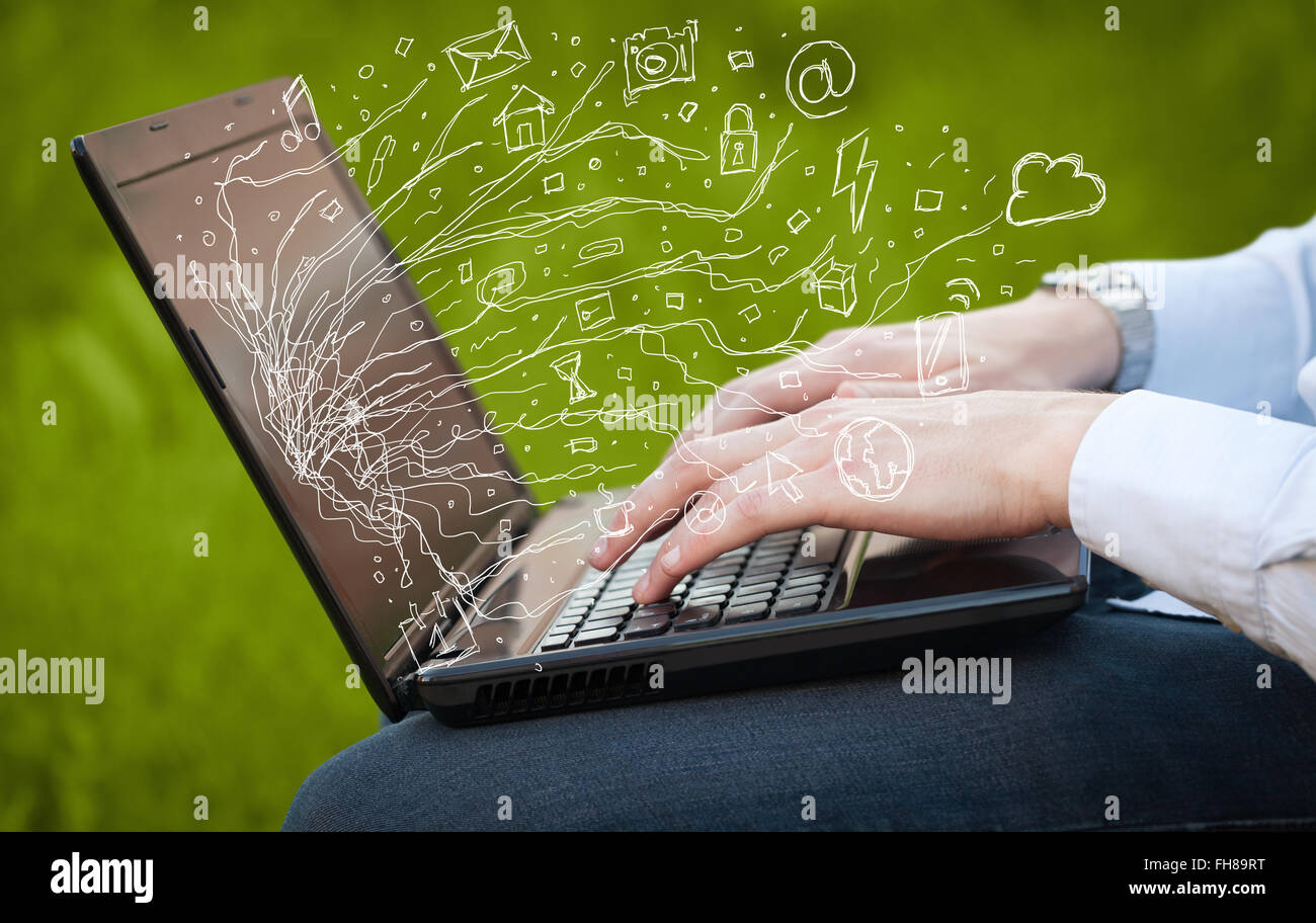 Man pressing notebook laptop computer with doodle icon cloud symbols ...