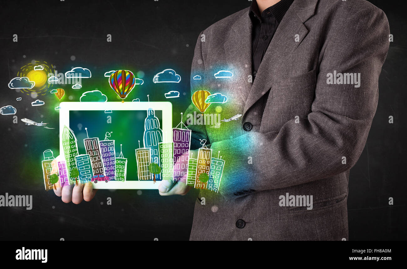 Young person showing tablet with hand drawn cityscape Stock Photo - Alamy