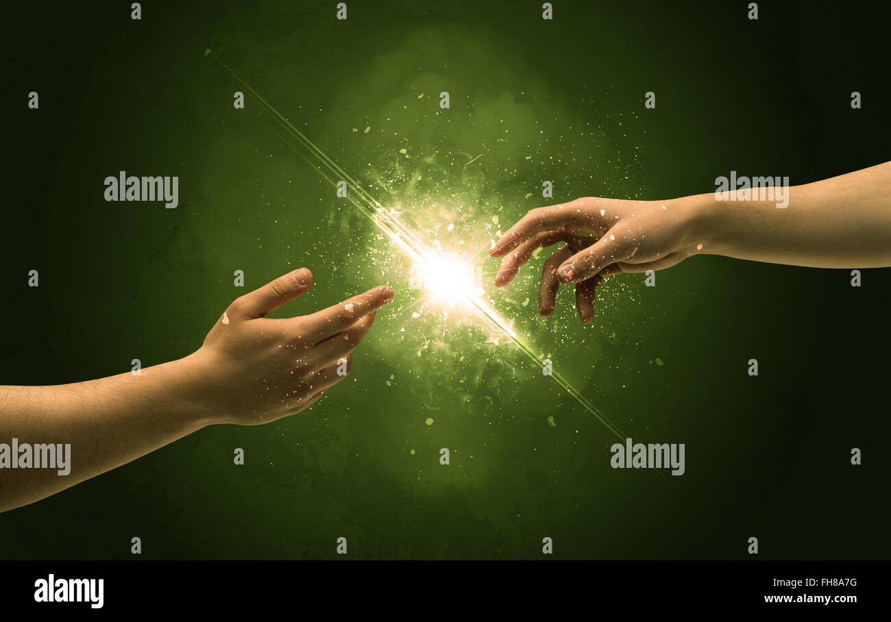 Touching arms lighting spark at fingertip Stock Photo - Alamy