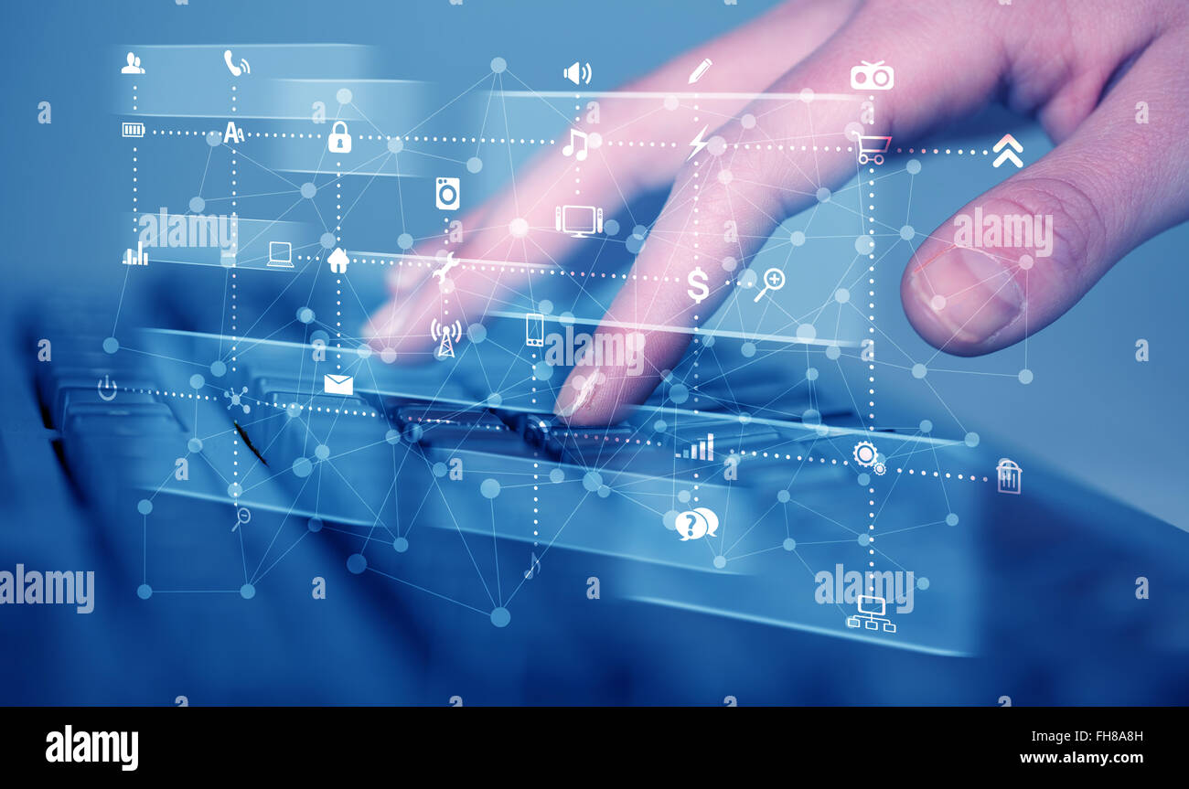 Hand pressing keyboard with high tech media icons Stock Photo - Alamy