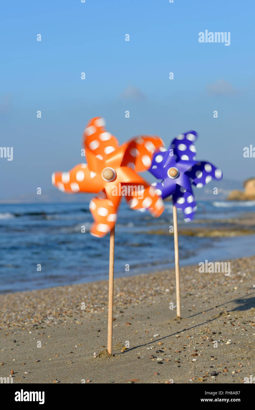 Spinning pinwheels on a beach Stock Photo - Alamy