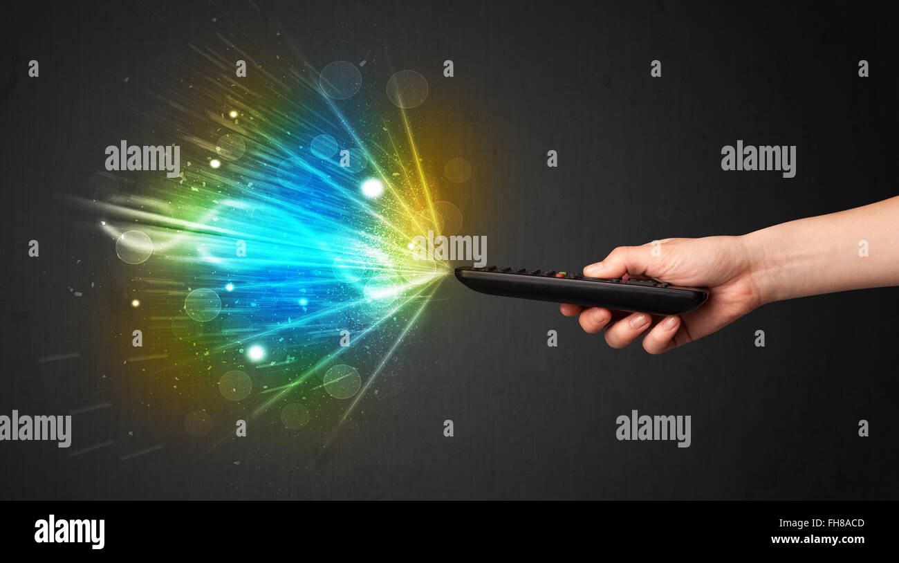 Hand with remote control and explosive signal Stock Photo - Alamy