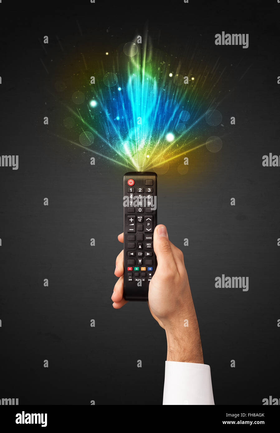 Hand with remote control and explosive signal Stock Photo - Alamy