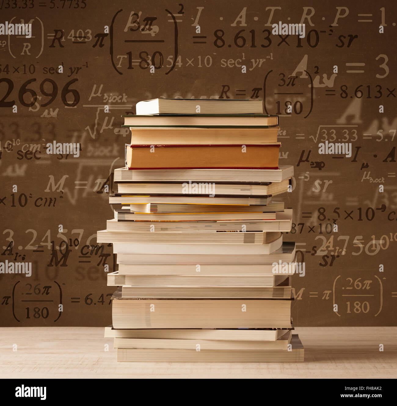 Books on vintage background with math formulas Stock Photo - Alamy