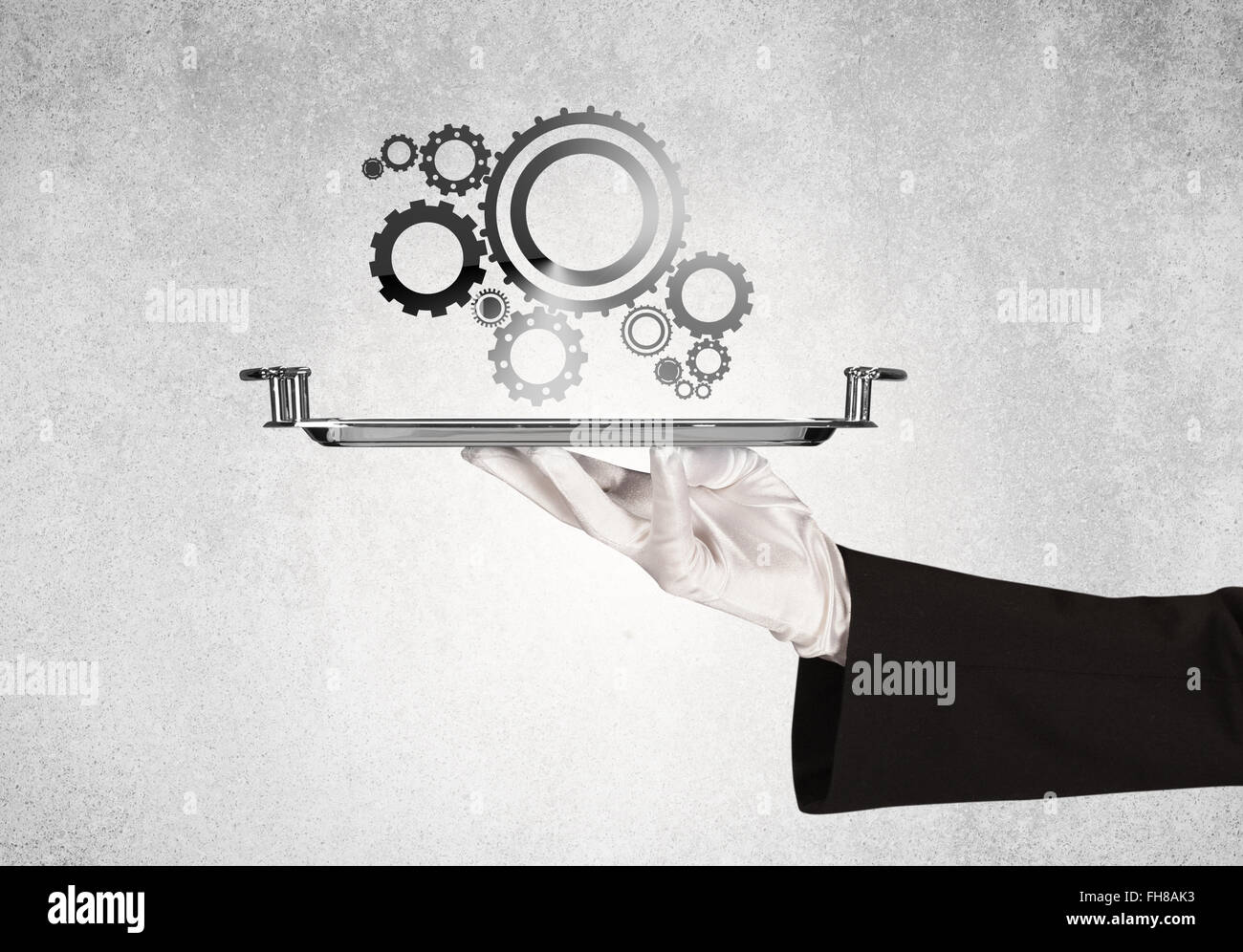 Working cog wheel concept on tray Stock Photo - Alamy