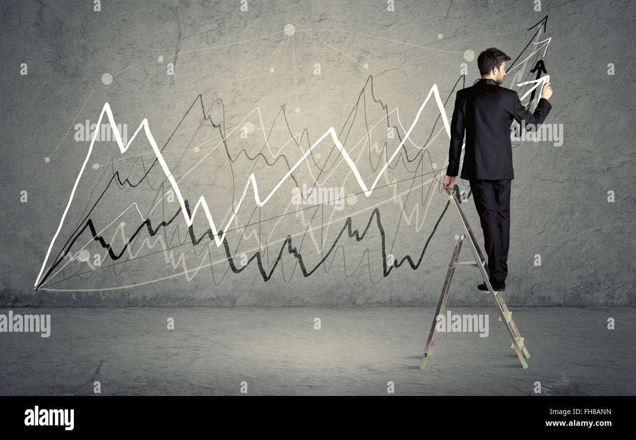 Man on ladder drawing lines Stock Photo - Alamy