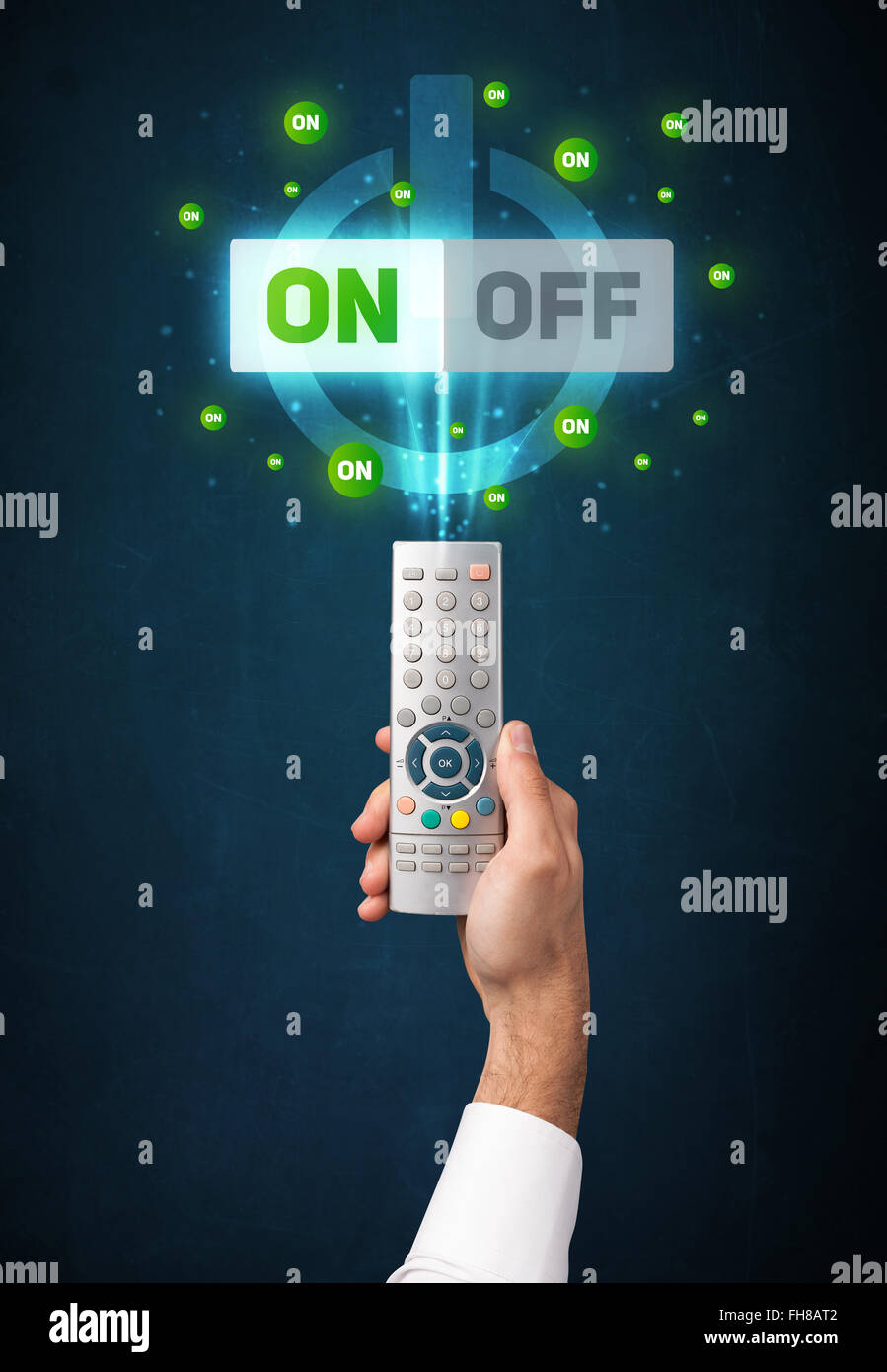 Hand with remote control and on-off signals Stock Photo - Alamy