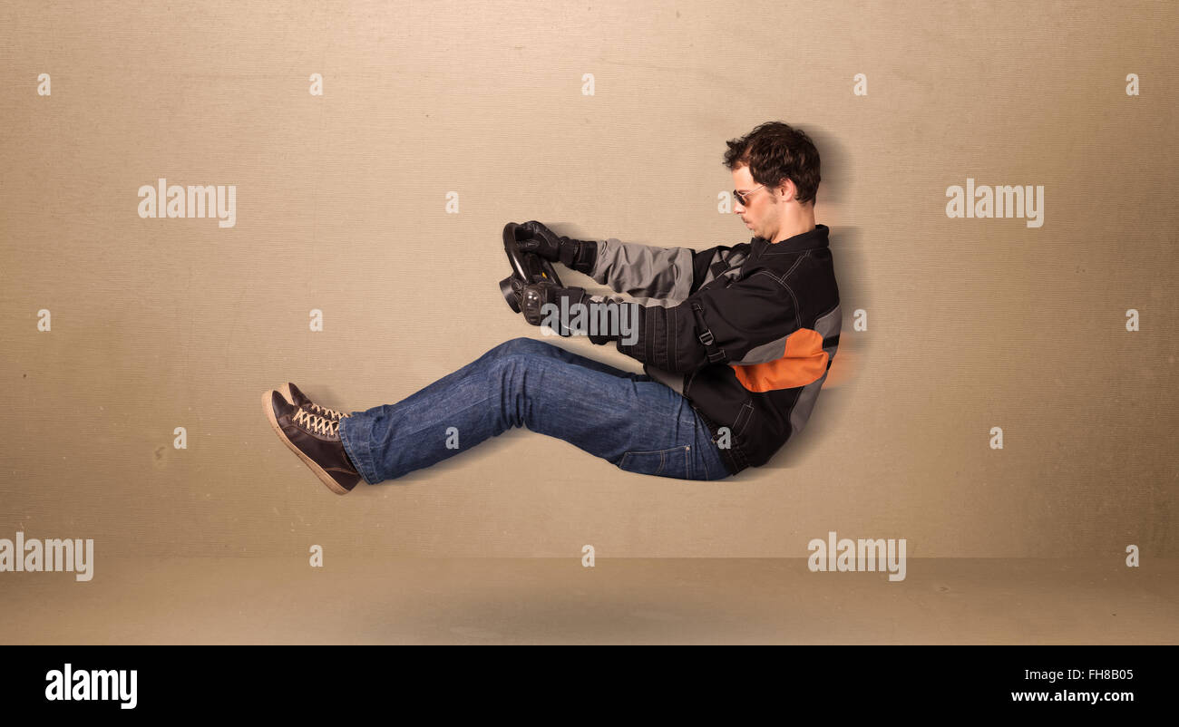 Happy funny man driving a flying car concept Stock Photo - Alamy