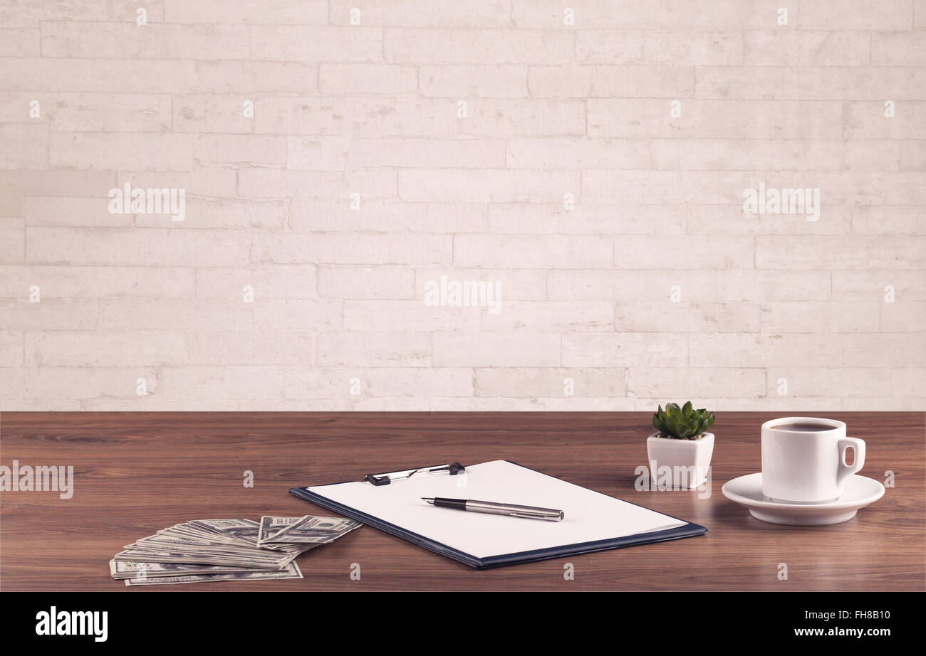 Office desk closeup with white brick wall Stock Photo - Alamy