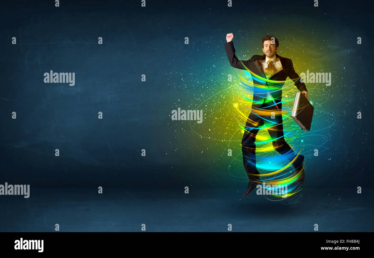 Excited business man jumping with energy colourful lines Stock Photo ...
