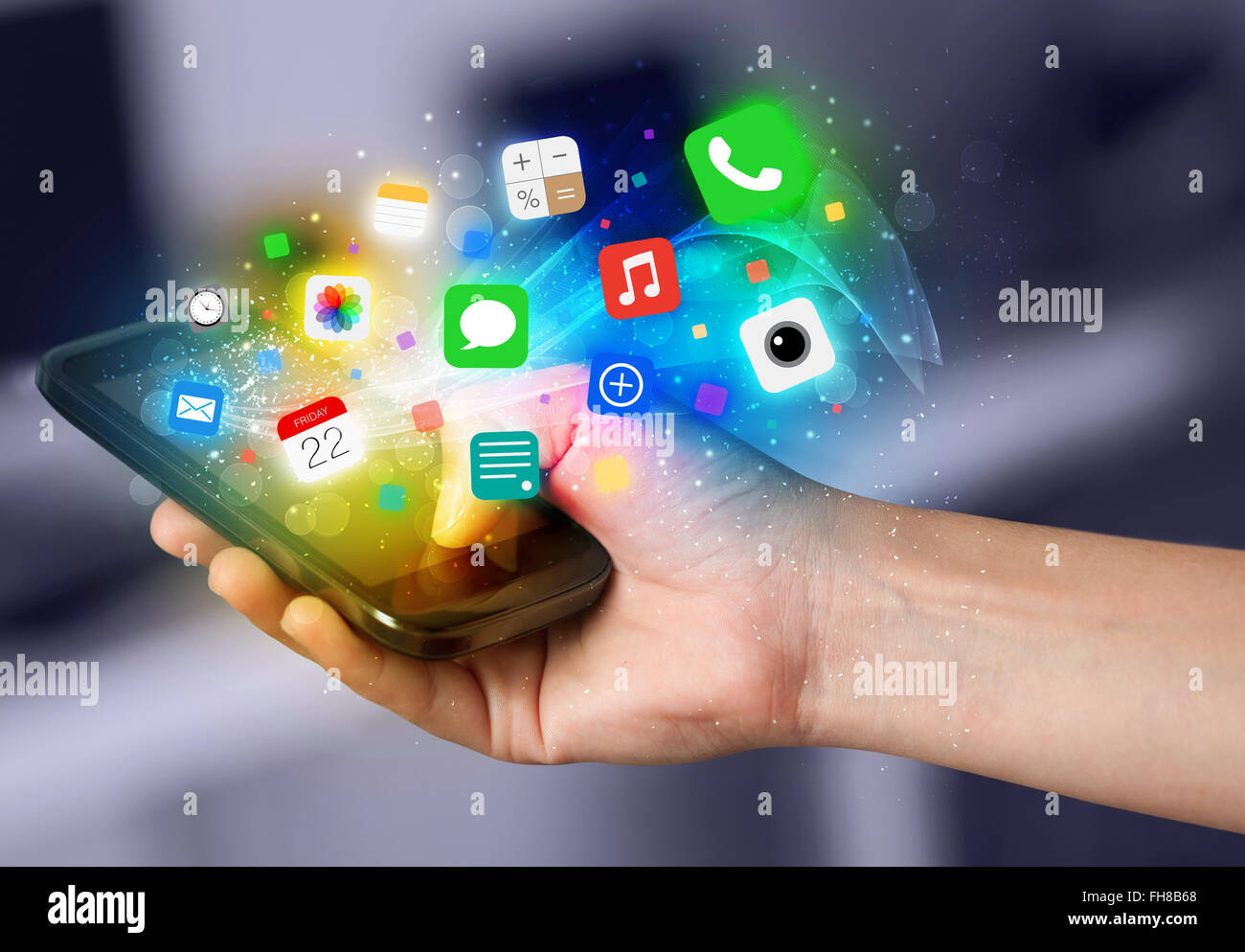 Hand holding smartphone with colorful app icons Stock Photo - Alamy