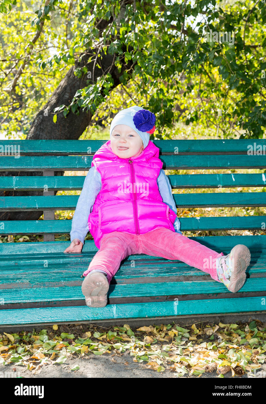 Adorable little child girl at fall. Use it for baby, parenting or love ...