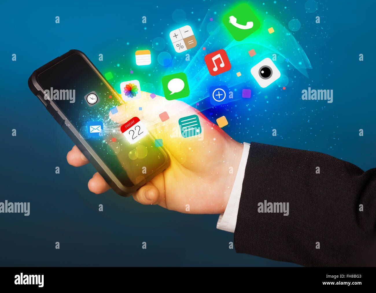 Hand holding smartphone with colorful app icons Stock Photo - Alamy