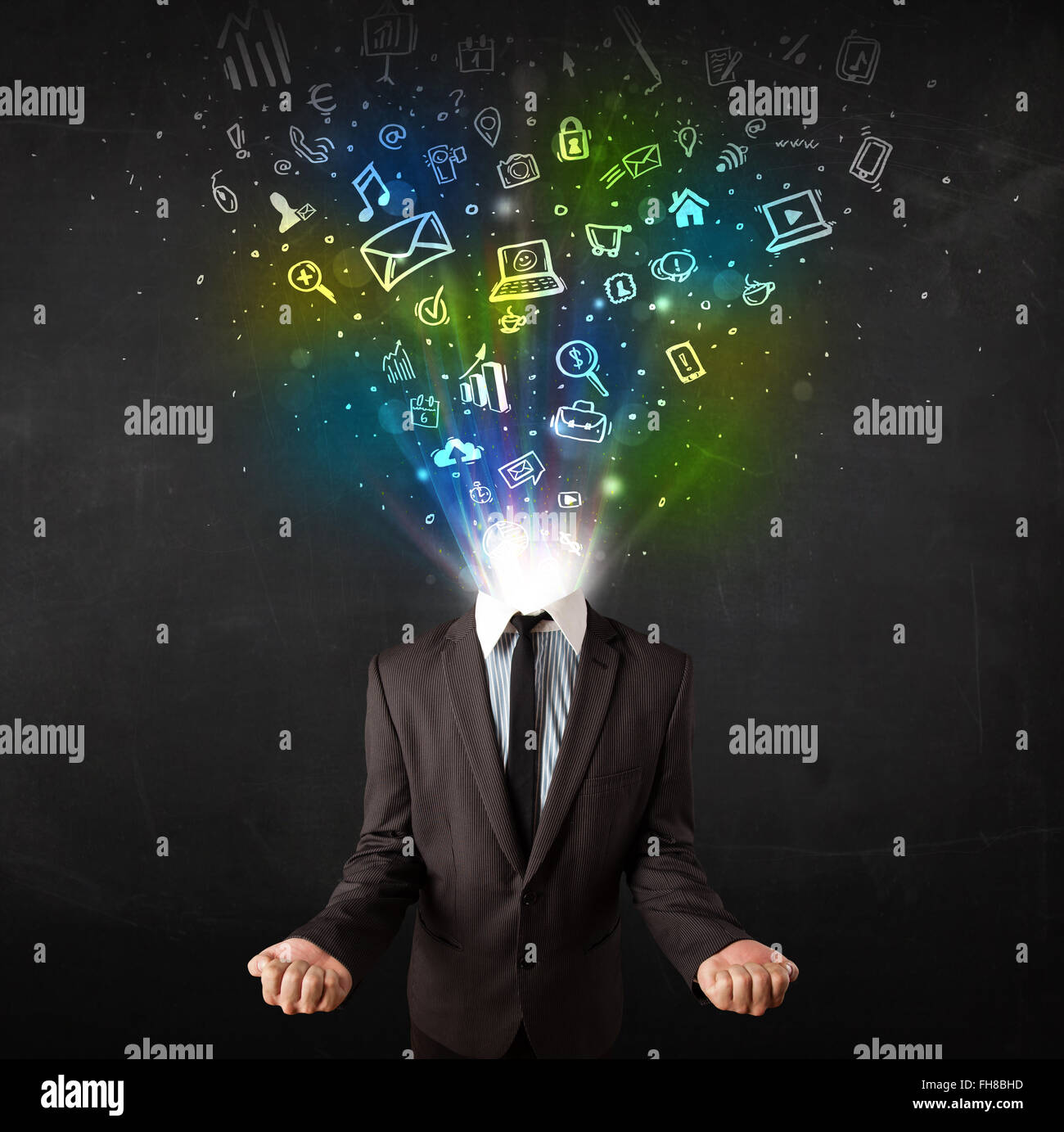 Business man with glowing media icons exploding head Stock Photo - Alamy