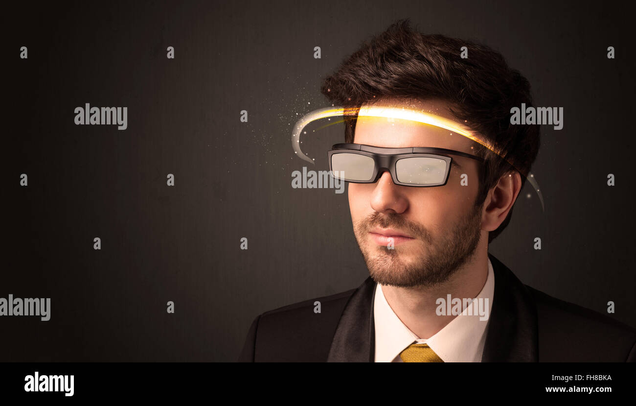 Handsome man looking with futuristic high tech glasses Stock Photo - Alamy