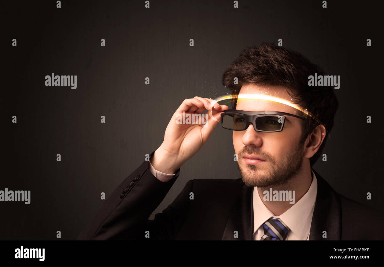 Handsome man looking with futuristic high tech glasses Stock Photo - Alamy
