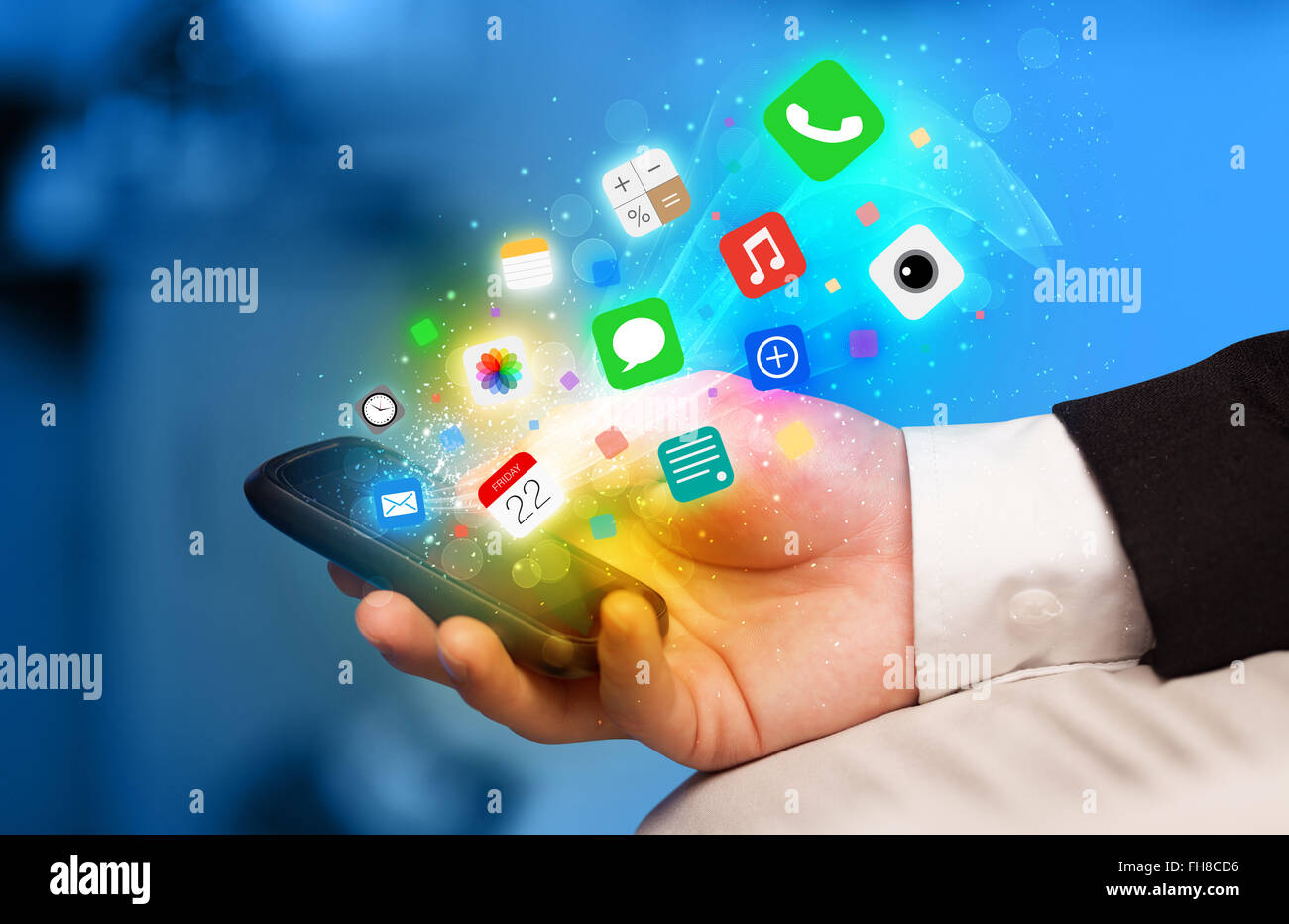 Hand holding smartphone with colorful app icons Stock Photo - Alamy