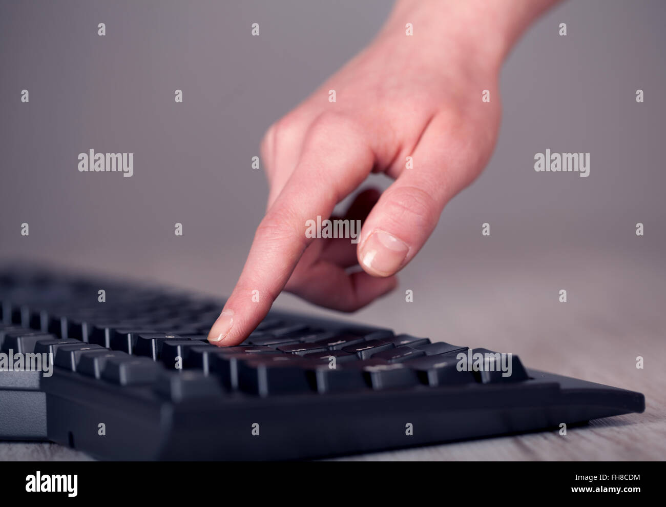 Close up of hand pressing keyboard buttons Stock Photo - Alamy