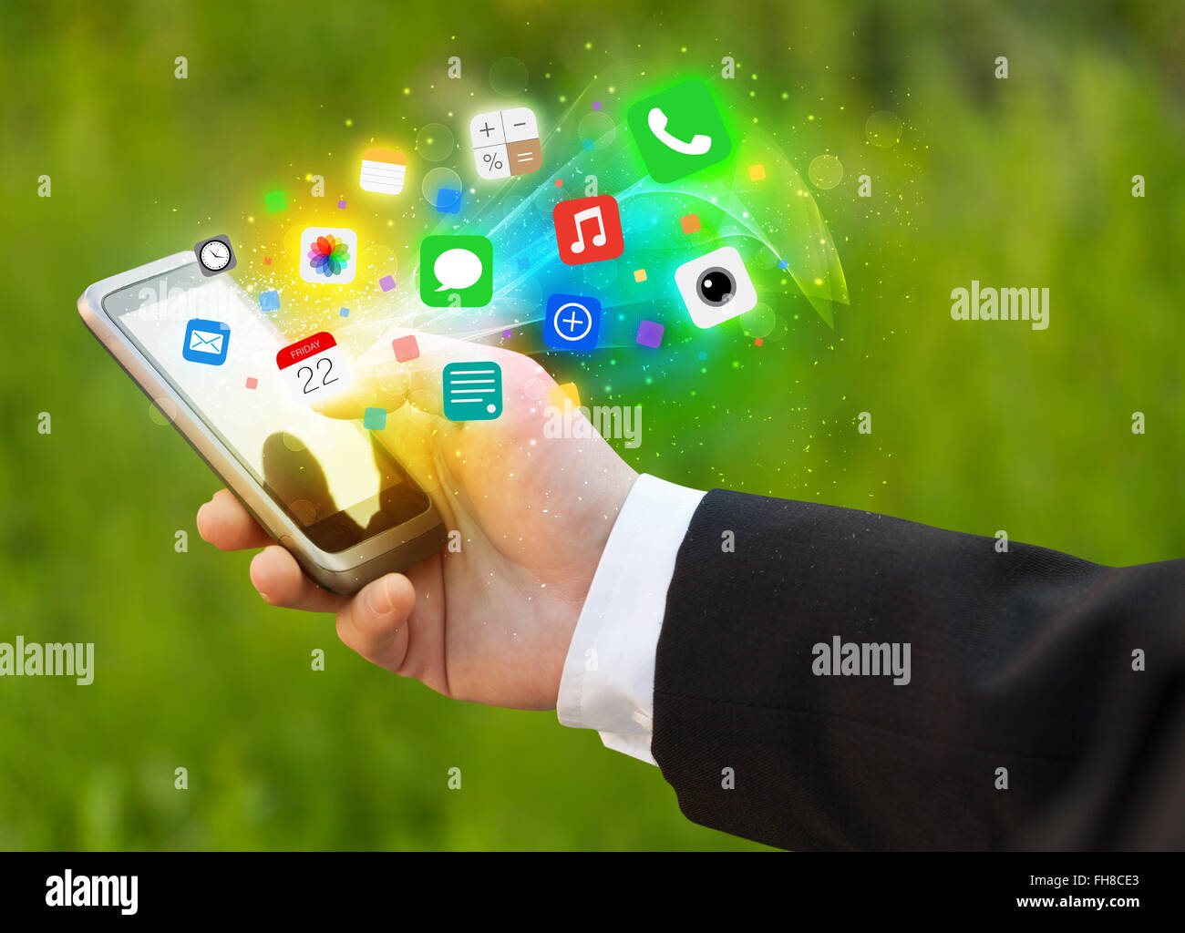 Hand holding smartphone with colorful app icons Stock Photo - Alamy