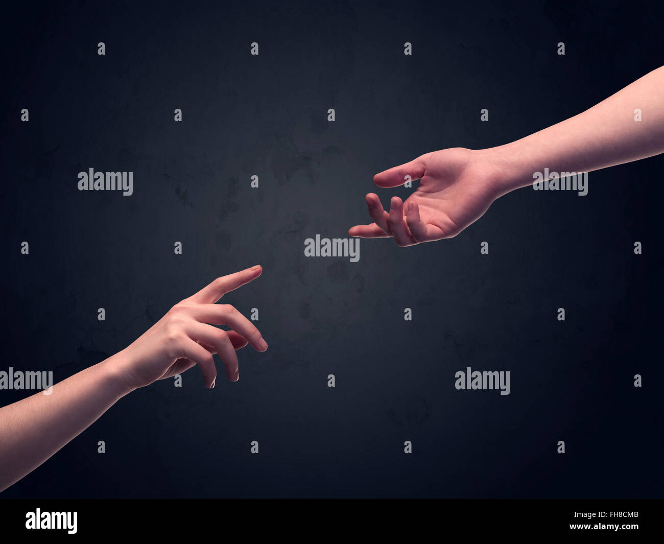 Hand about to touch another one Stock Photo - Alamy