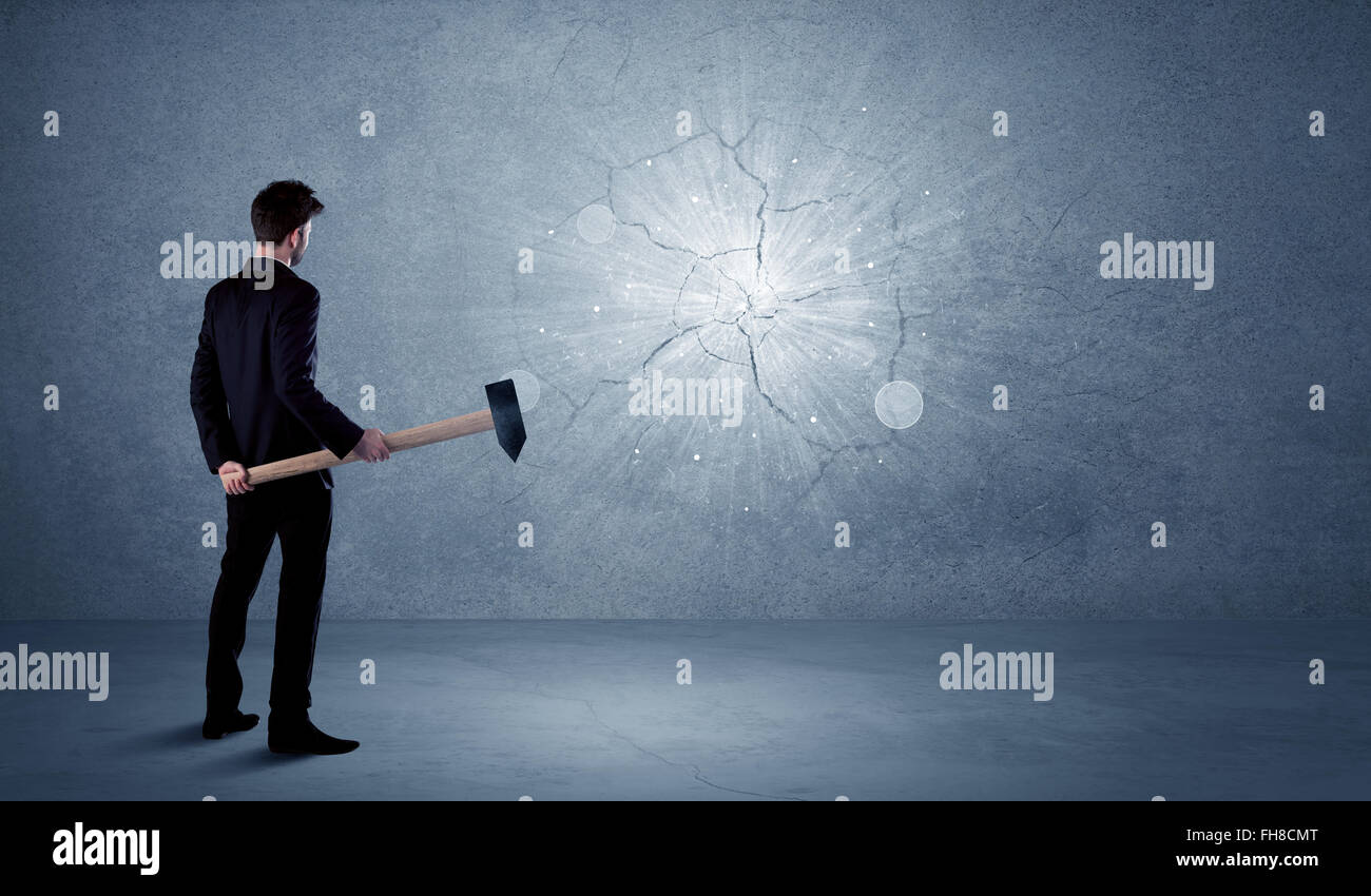 Business man hitting wall hammer hi-res stock photography and images ...