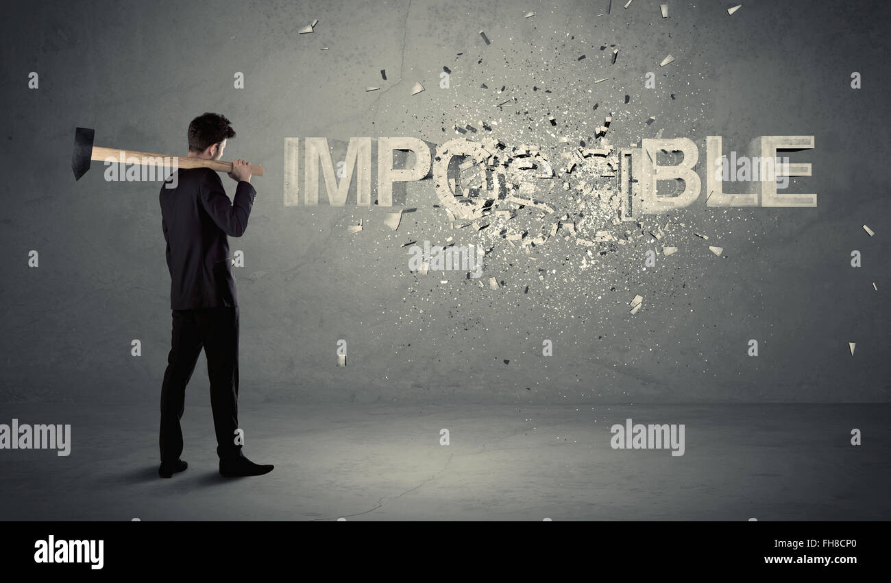 Business man hitting wall hammer hi-res stock photography and images ...