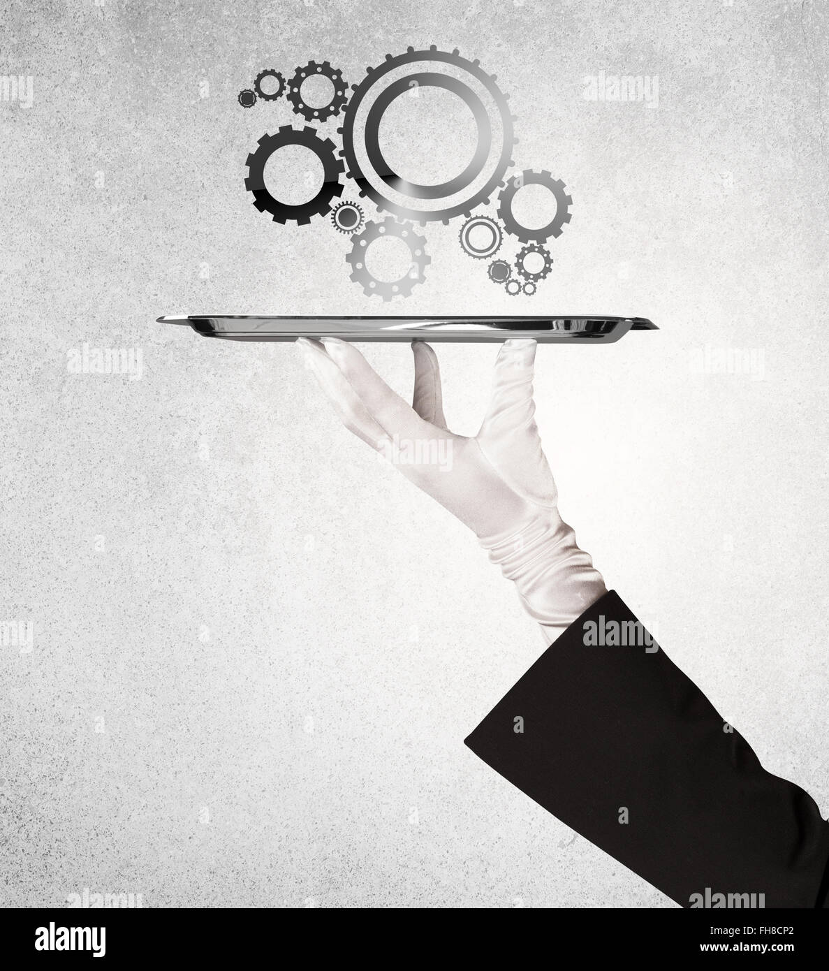 Working cog wheel concept on tray Stock Photo - Alamy