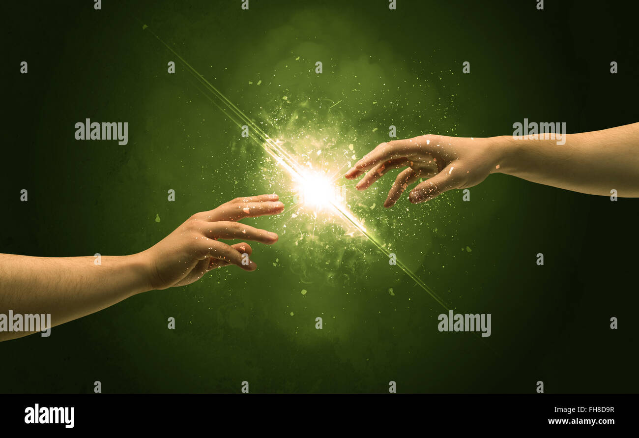 Touching arms lighting spark at fingertip Stock Photo - Alamy