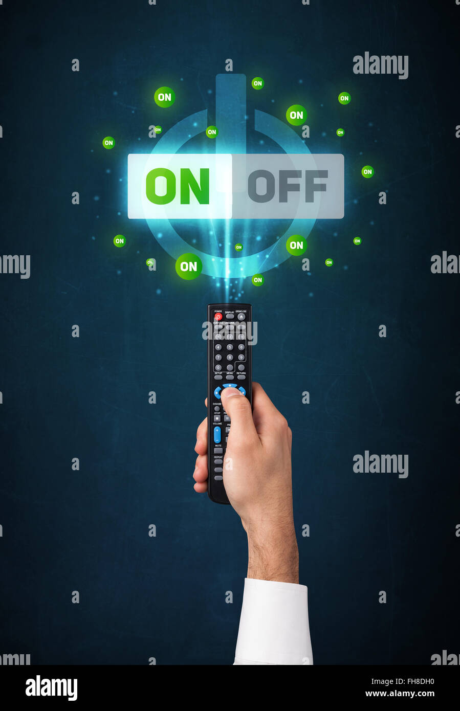 Hand with remote control and on-off signals Stock Photo - Alamy