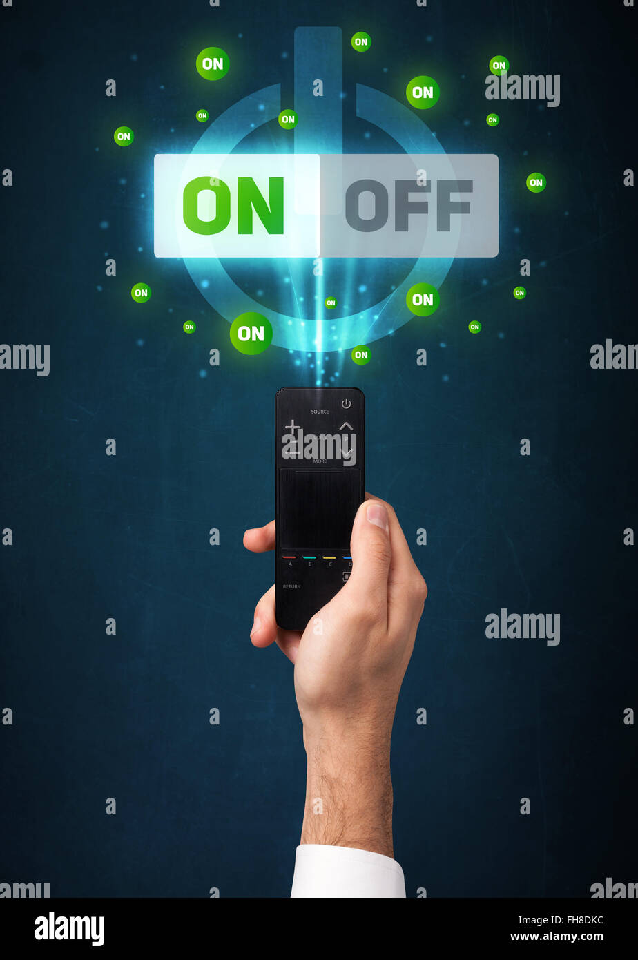 Hand with remote control and on-off signals Stock Photo - Alamy