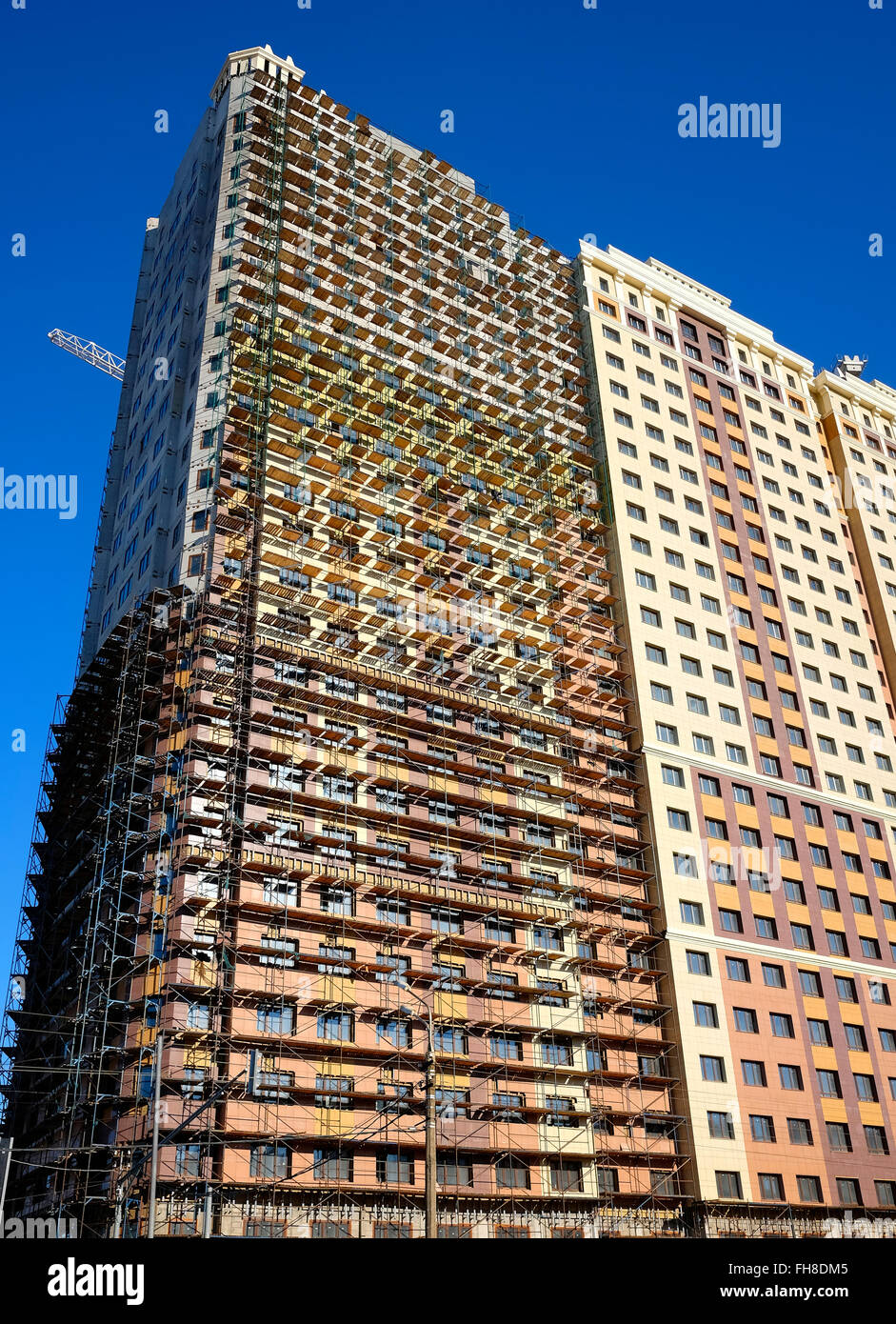 Zhukovsky, Russia, Construction scaffolding on a new high-rise building ...