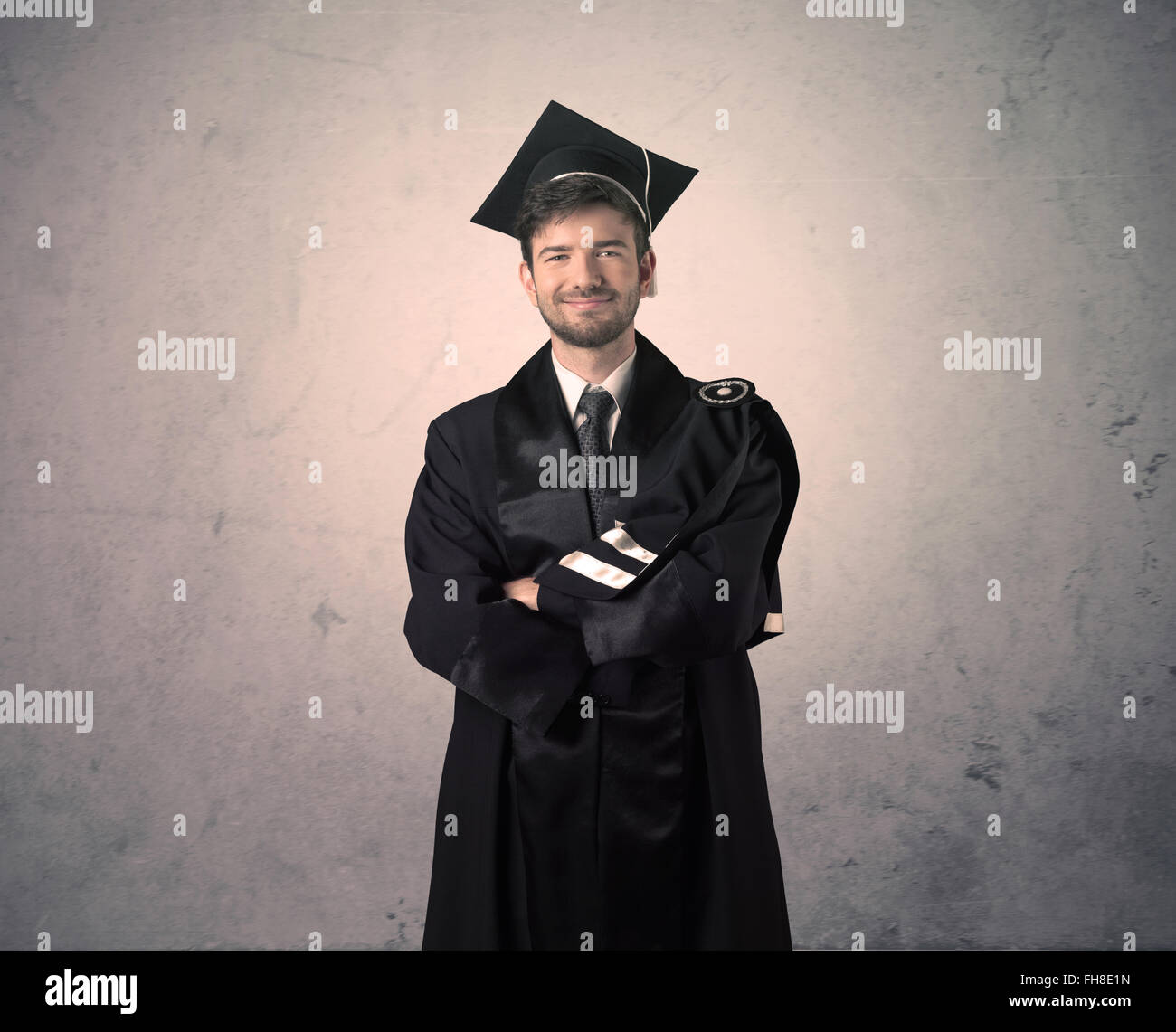 Portrait of a young graduate student on grungy background Stock Photo ...