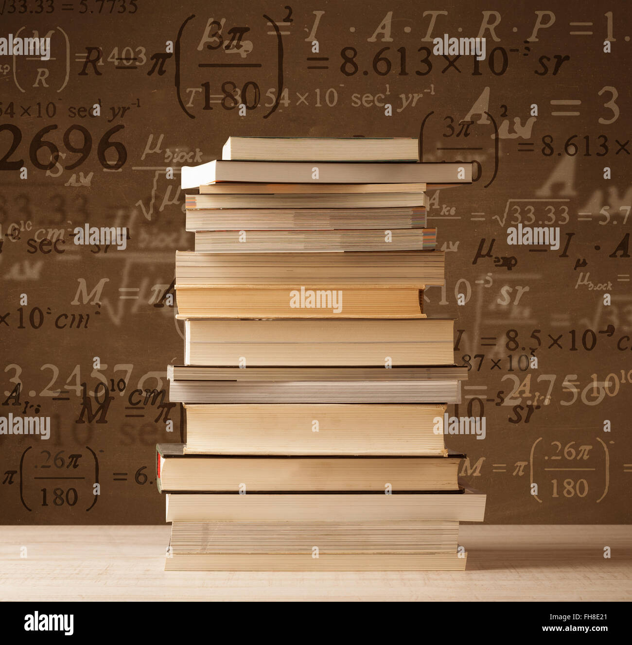 Books on vintage background with math formulas Stock Photo - Alamy