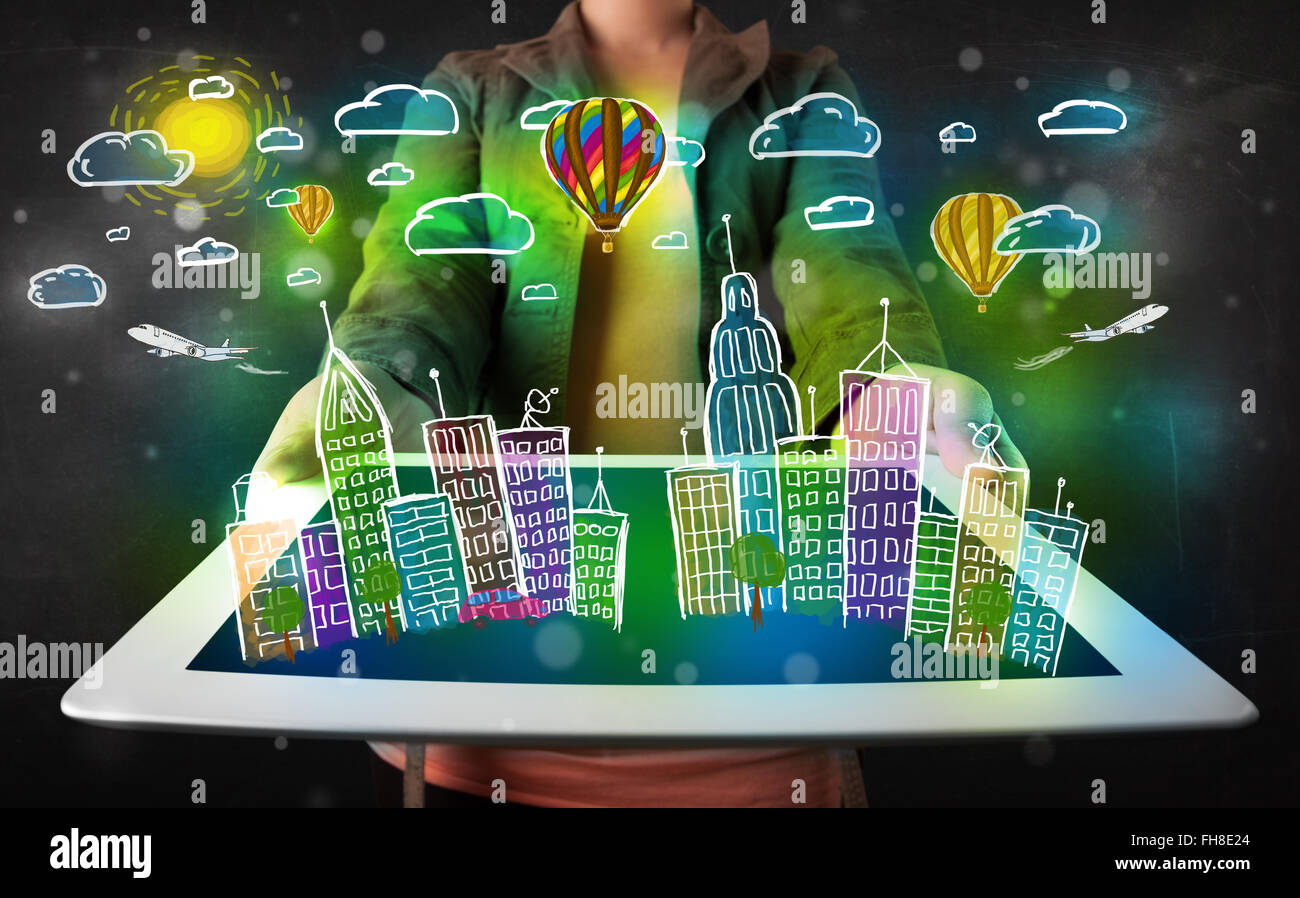 Young person showing tablet with hand drawn cityscape Stock Photo - Alamy