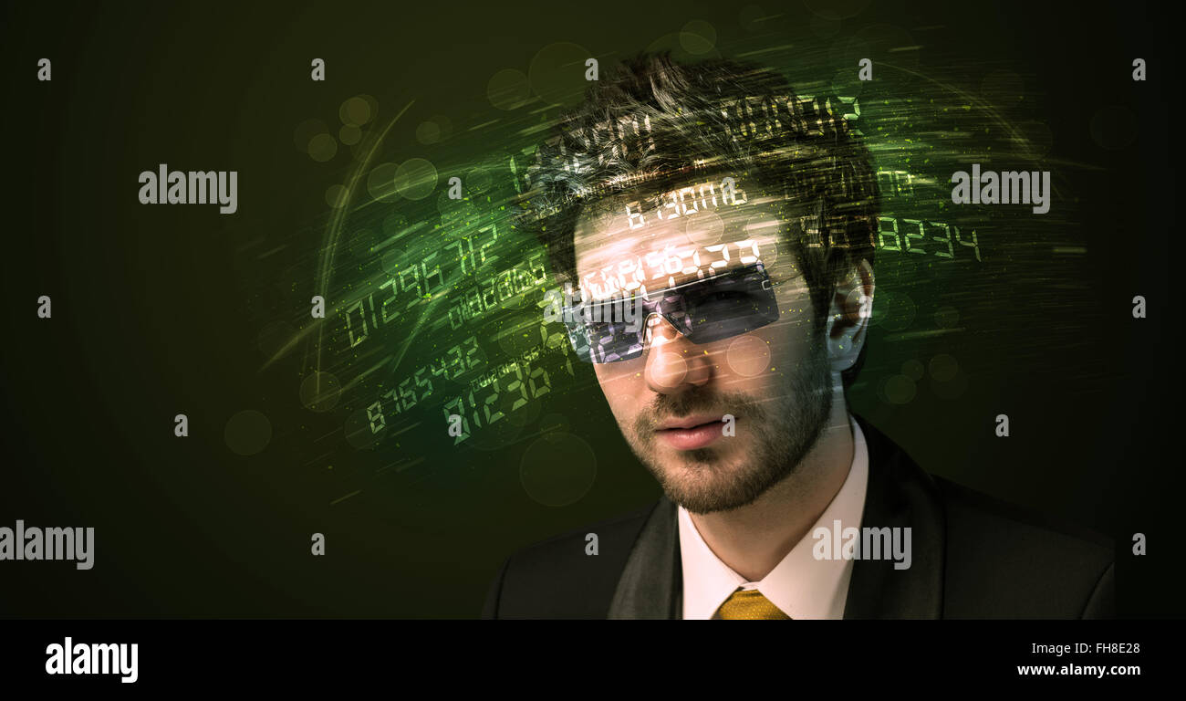Business man looking at high tech number calculations Stock Photo - Alamy