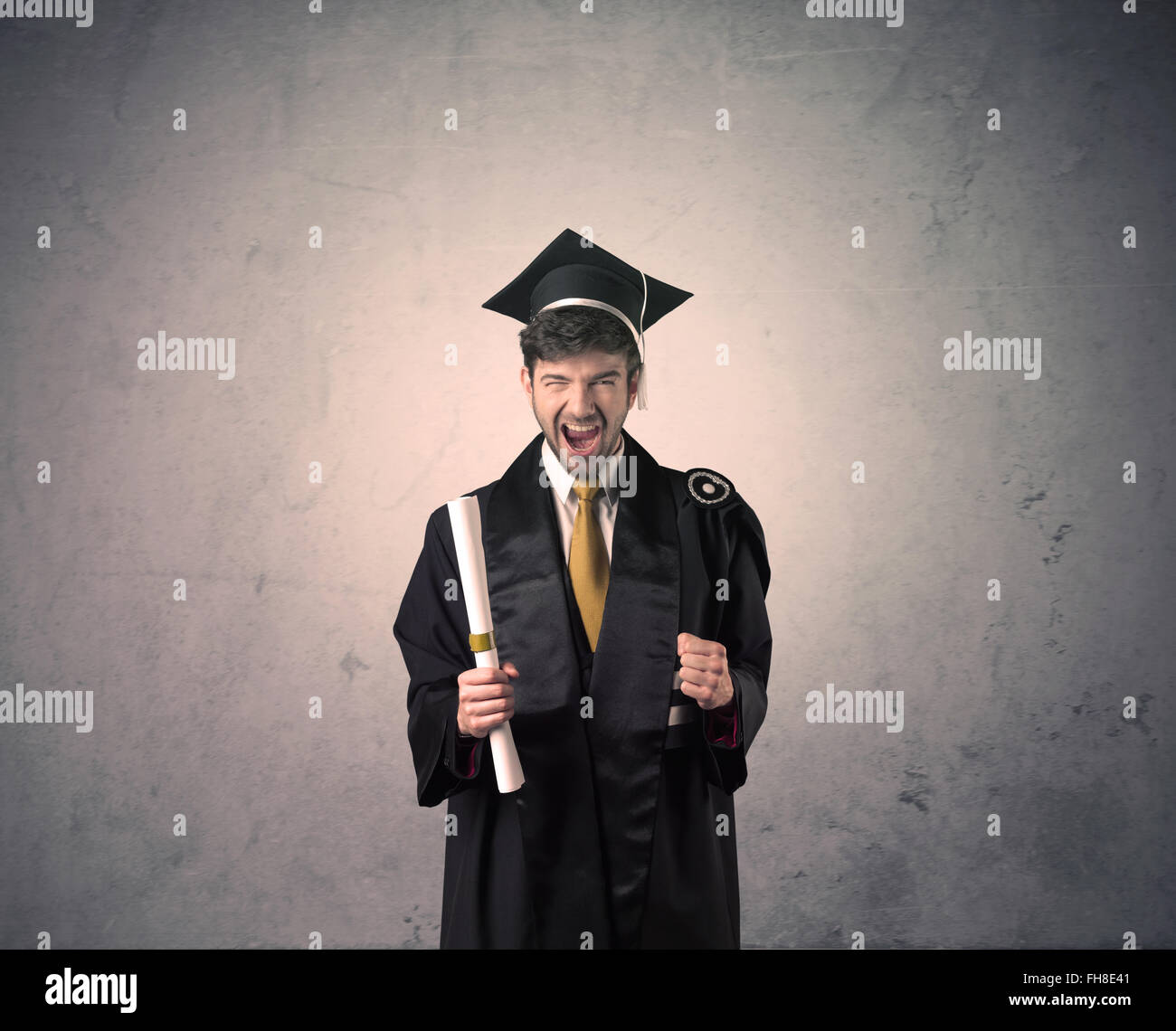 Portrait of a young graduate student on grungy background Stock Photo ...