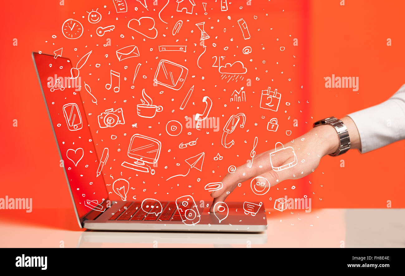 Laptop computer wtih hand drawn icons and symbols Stock Photo - Alamy