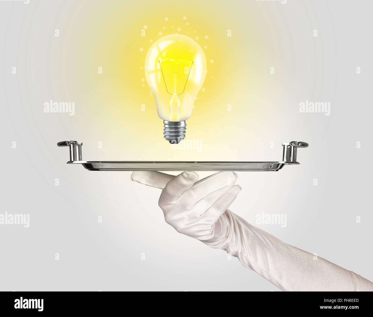 Clever idea concept with bulb on tray Stock Photo - Alamy