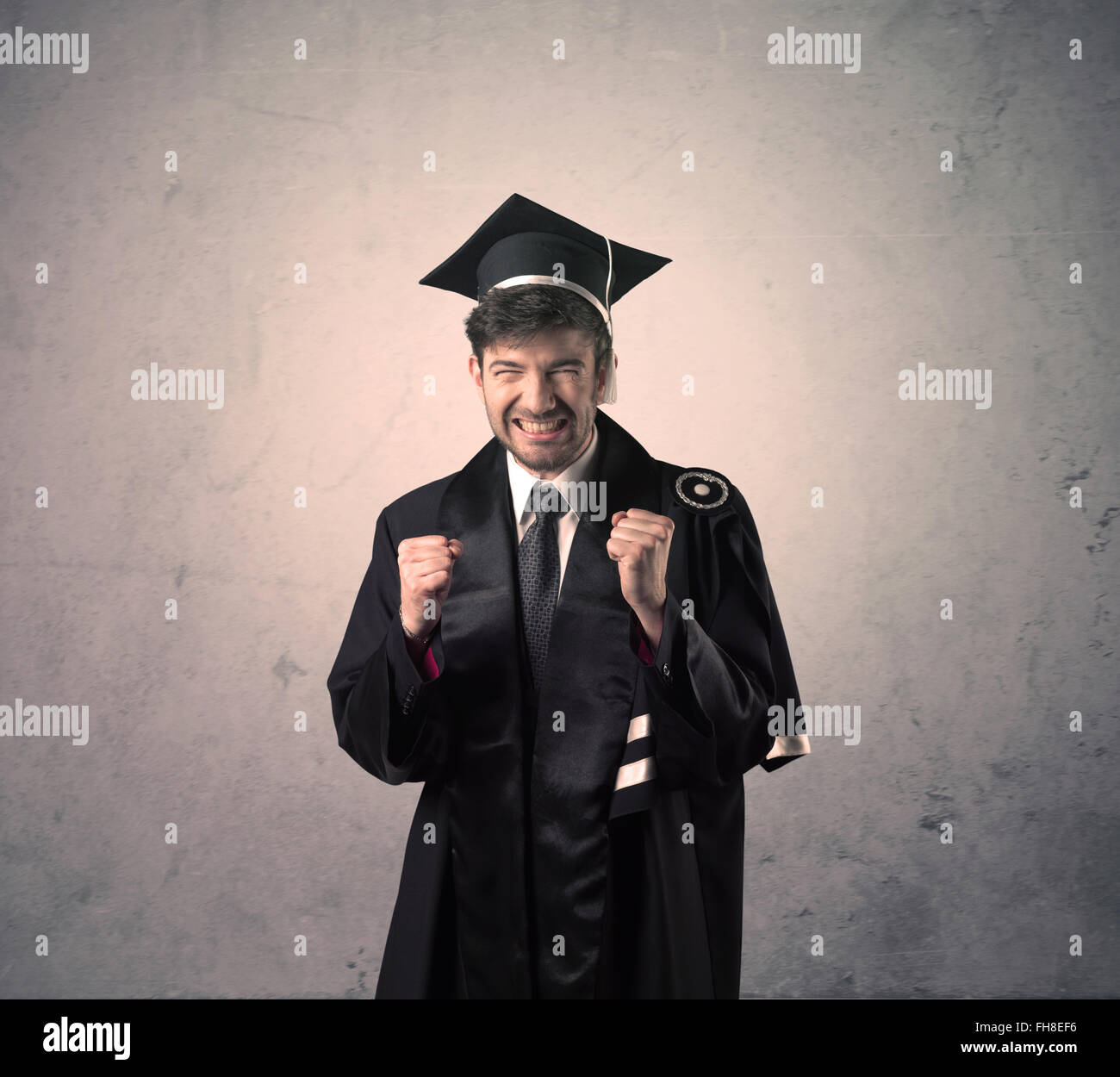 Portrait of a young graduate student on grungy background Stock Photo ...