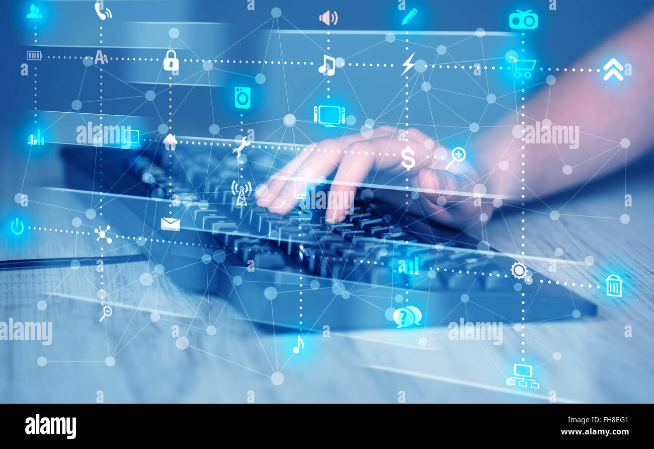 Hand pressing keyboard with high tech media icons Stock Photo - Alamy