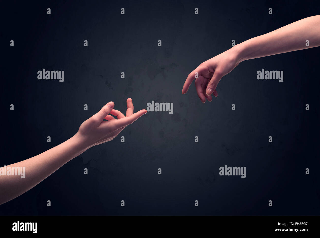 Hand about to touch another one Stock Photo - Alamy