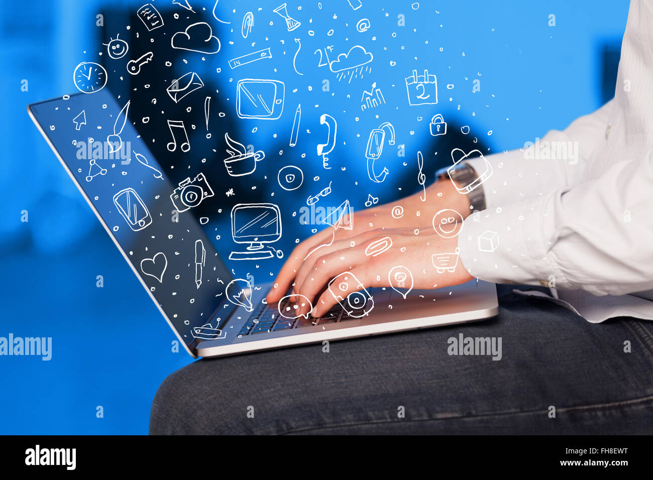 Laptop computer wtih hand drawn icons and symbols Stock Photo - Alamy