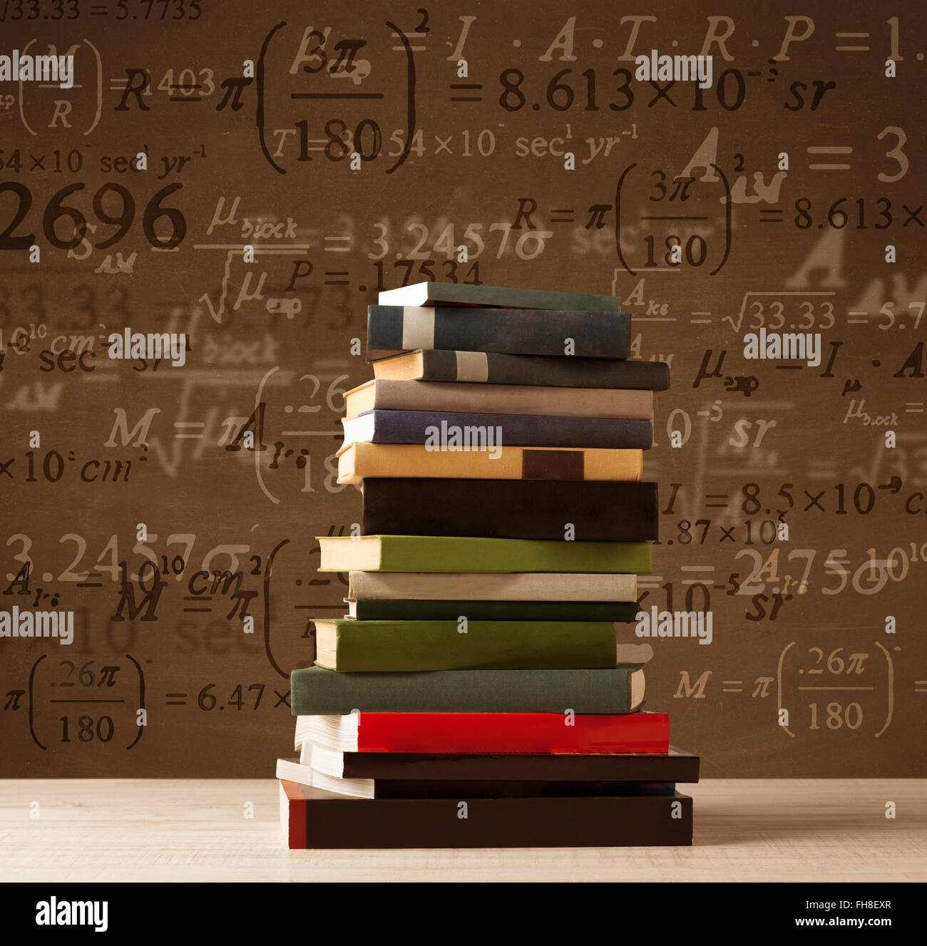 Books on vintage background with math formulas Stock Photo - Alamy