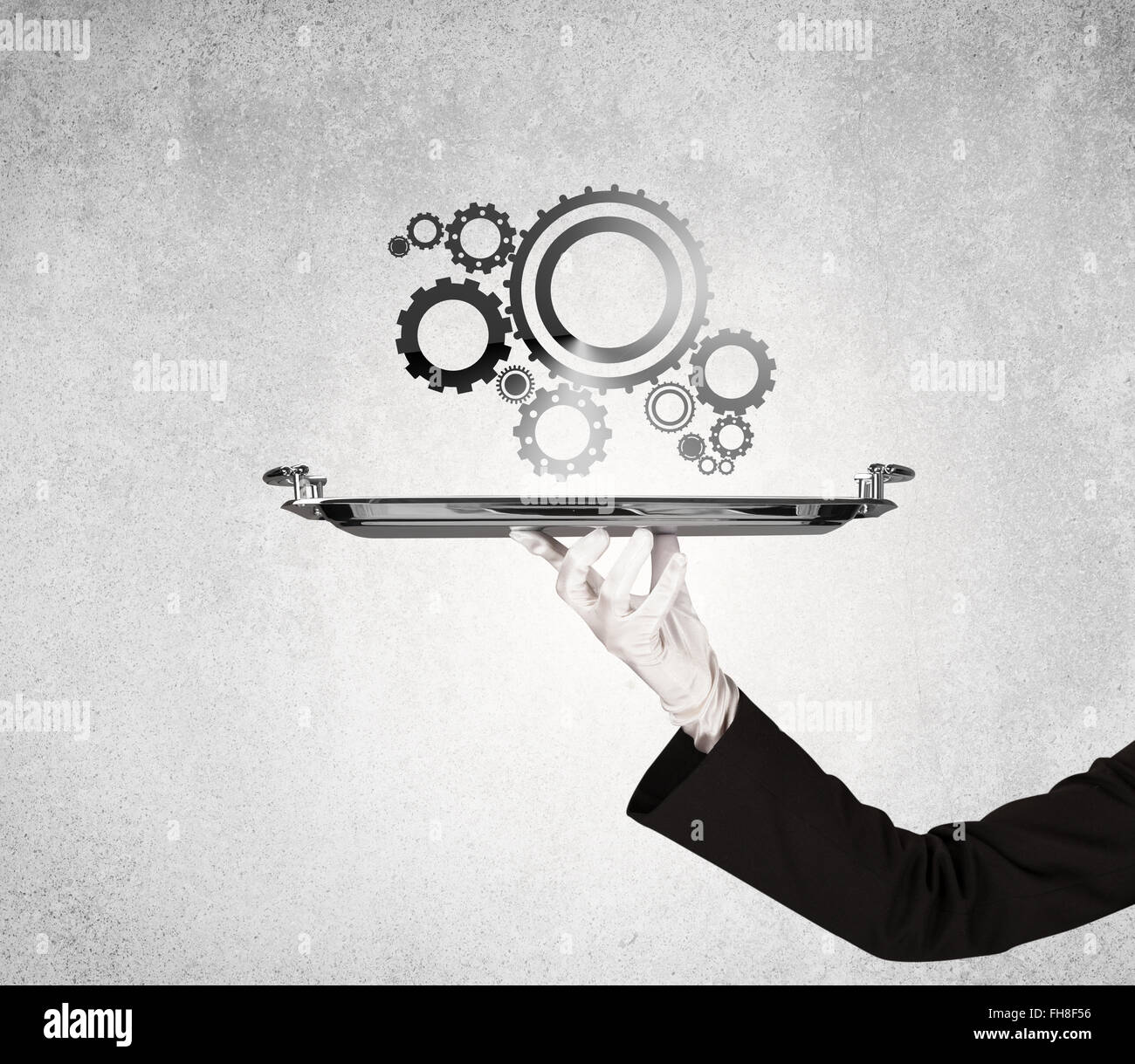 Working cog wheel concept on tray Stock Photo - Alamy
