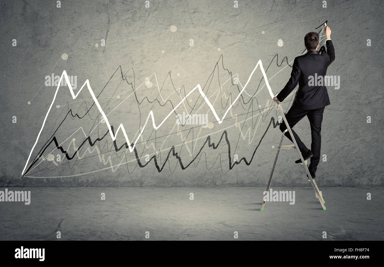 Man on ladder drawing lines Stock Photo - Alamy