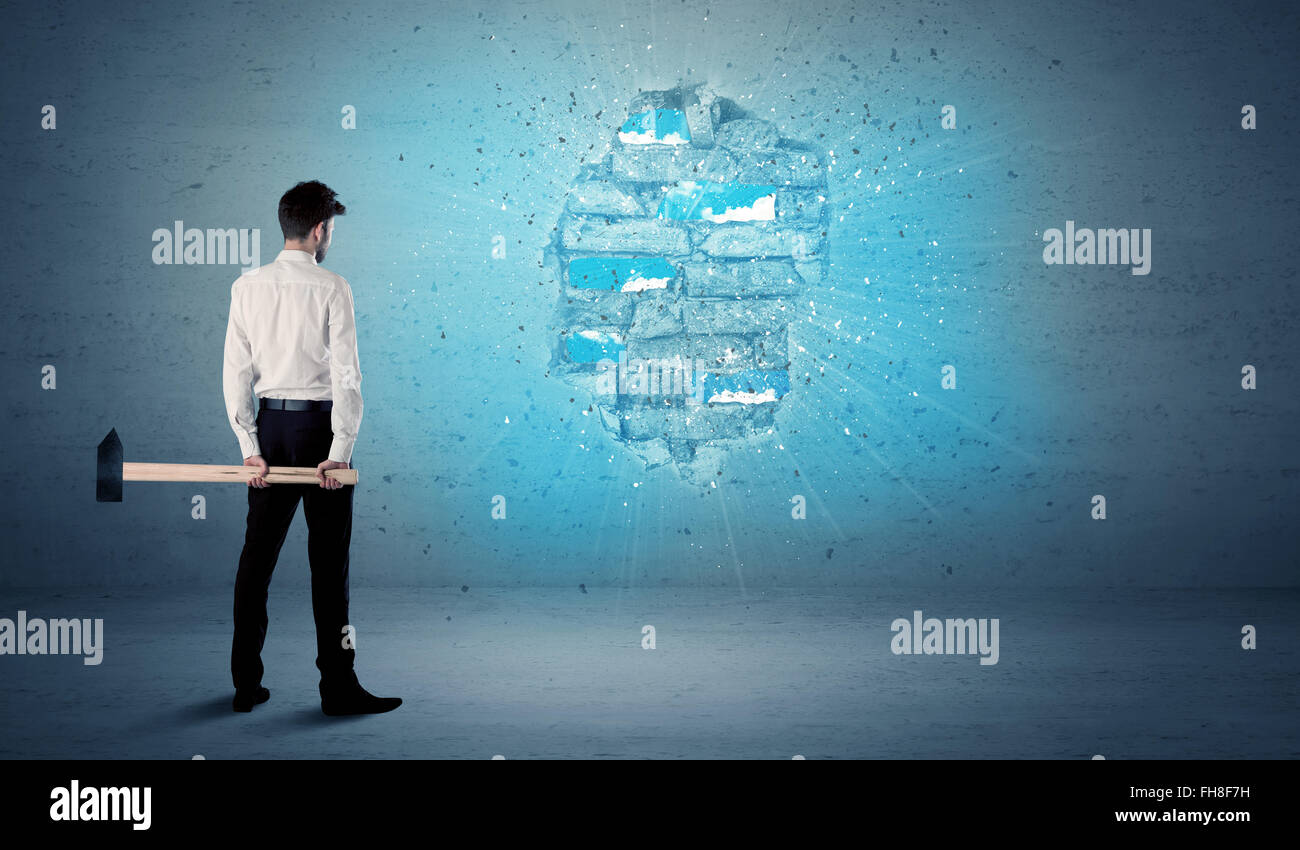 Business man hitting brick wall with huge hammer Stock Photo - Alamy