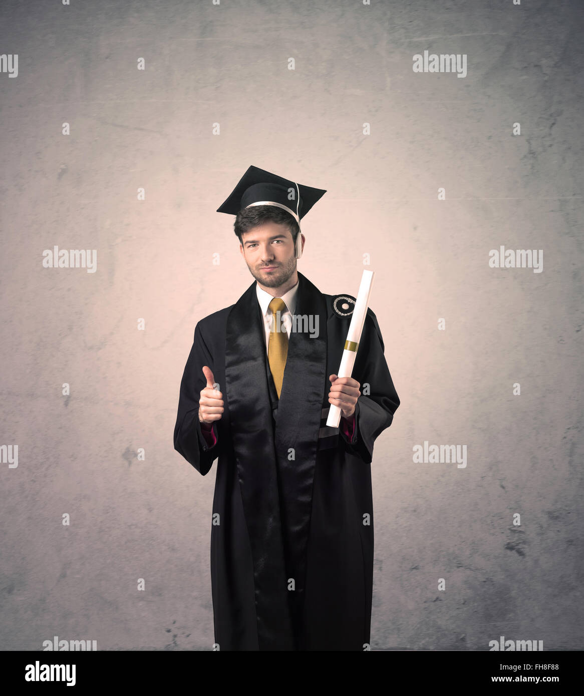 Portrait of a young graduate student on grungy background Stock Photo ...