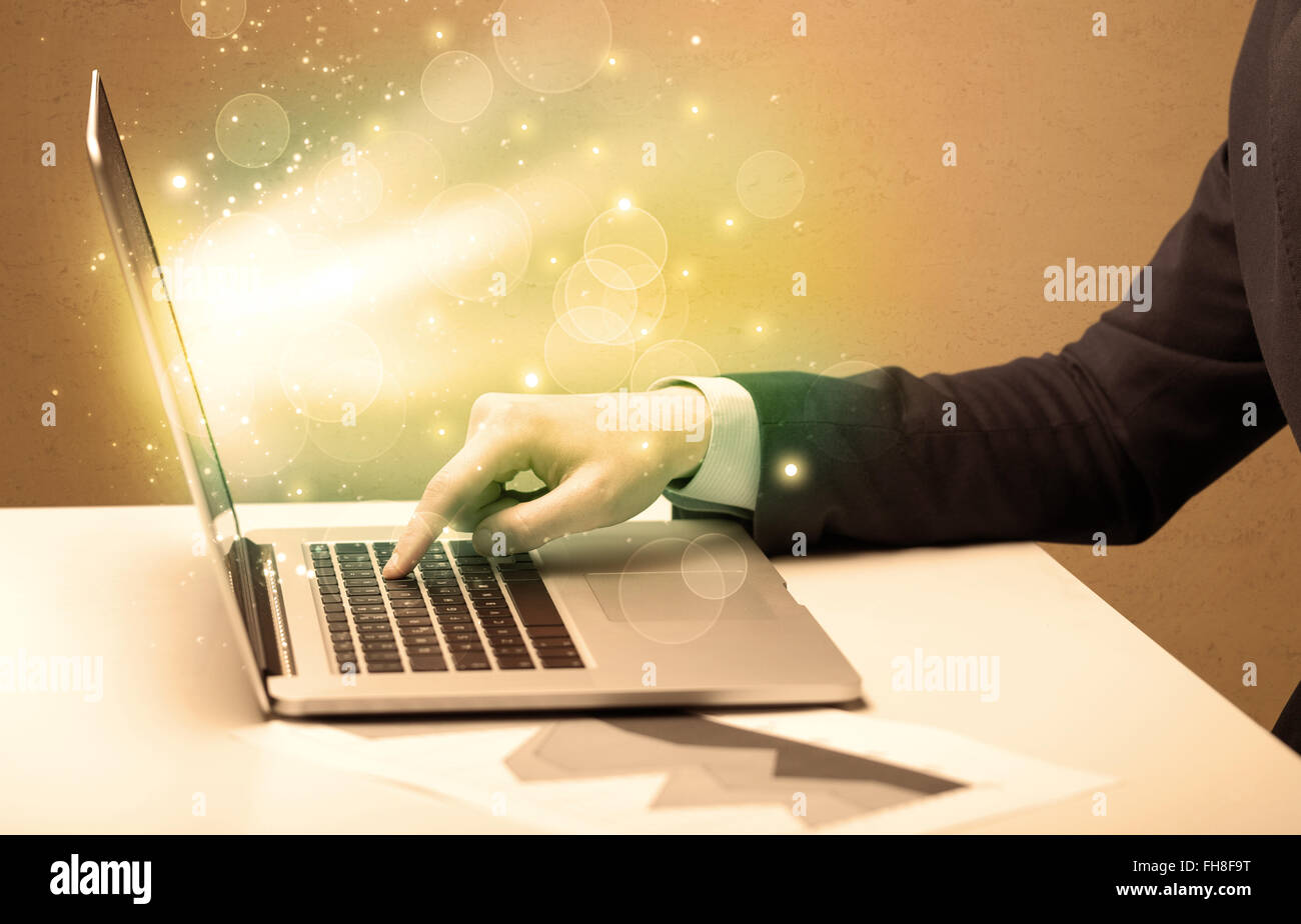 Businessman working fast on laptop Stock Photo - Alamy