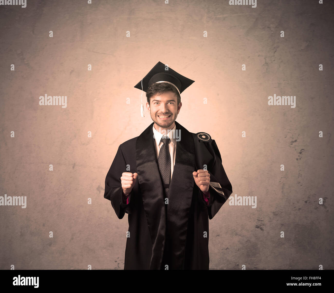 Portrait of a young graduate student on grungy background Stock Photo ...